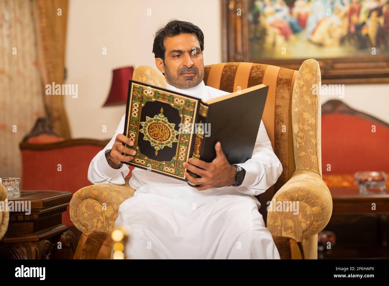 Arab Muslim man reading the holy book the Quran Kareem Stock Photo - Alamy