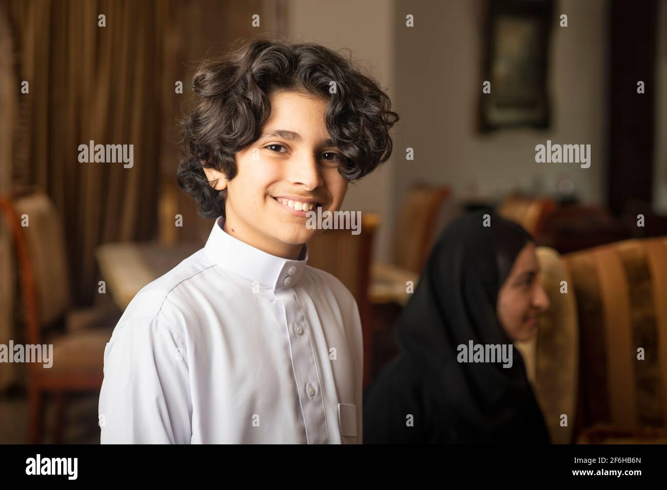 Young arabian boy smiling at home Stock Photo - Alamy