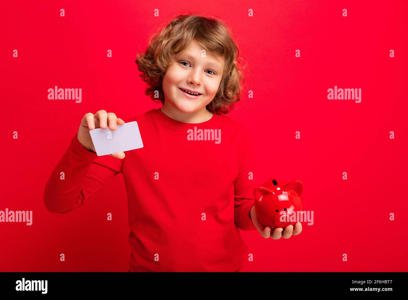 Photo of positive happy smiling little male child with curly blond hair ...