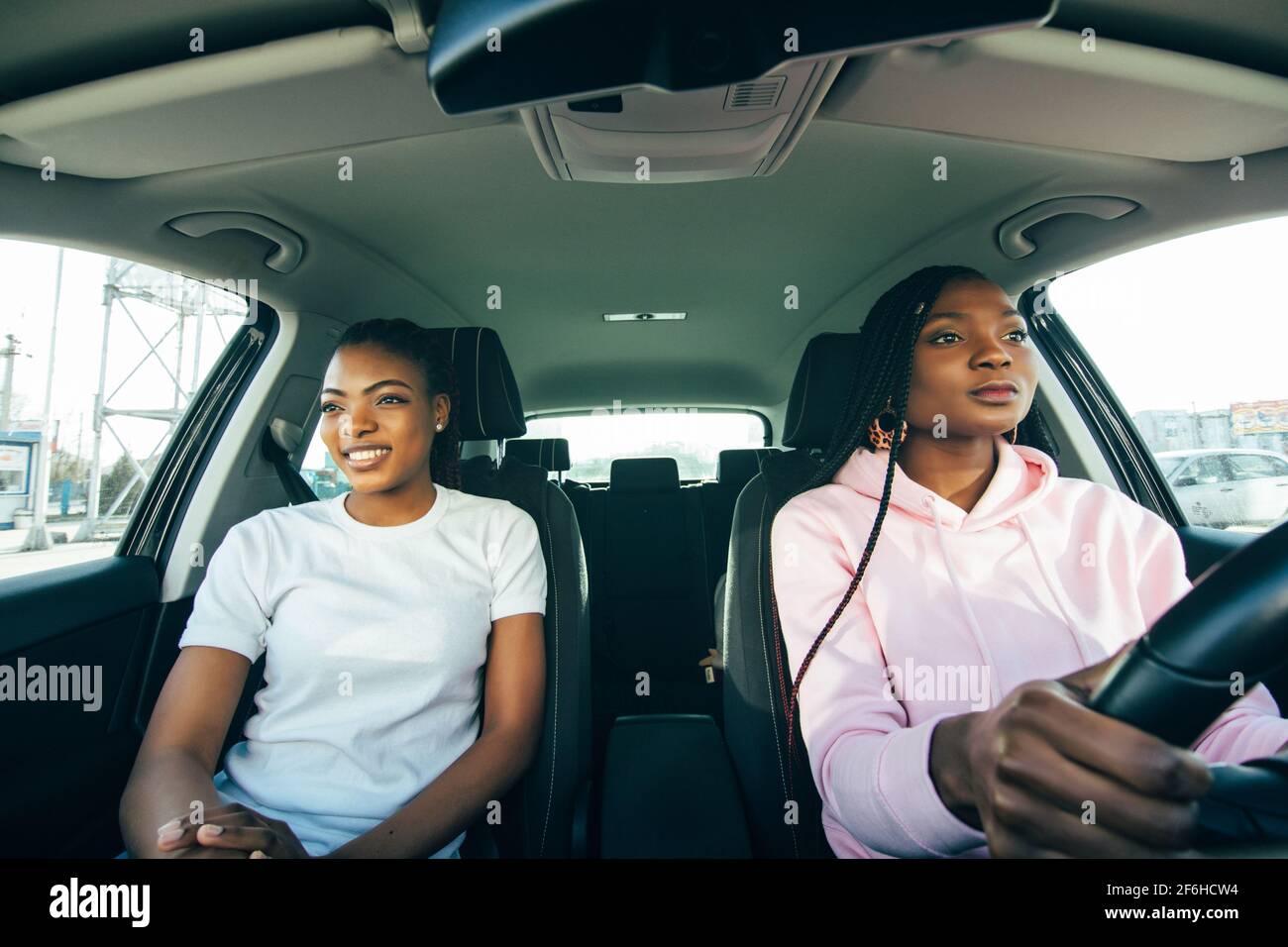 Friends on a road trip talking in car hi-res stock photography and ...