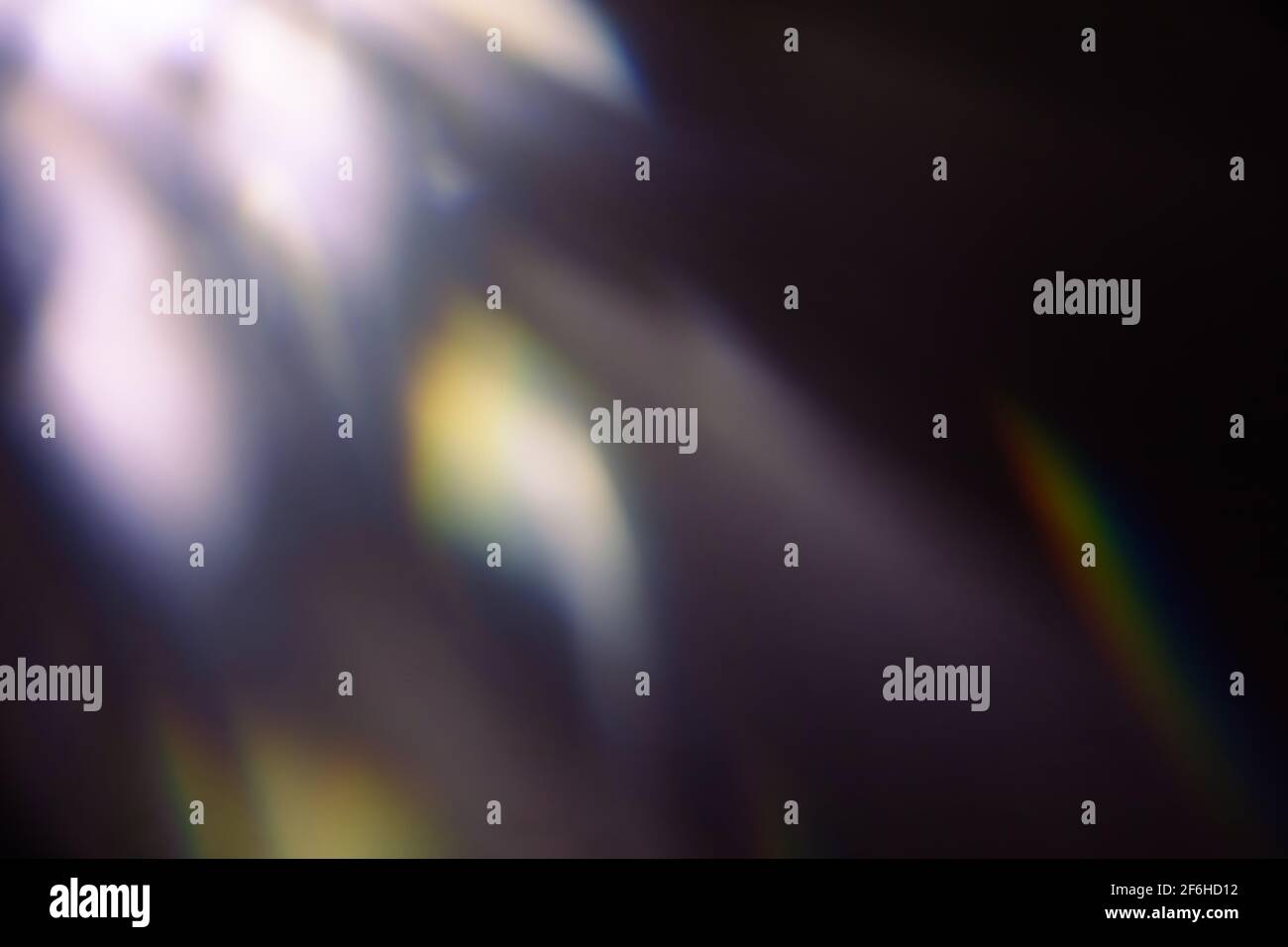 colorful warm rainbow light leaks on black background with dust texture Stock Photo - Alamy