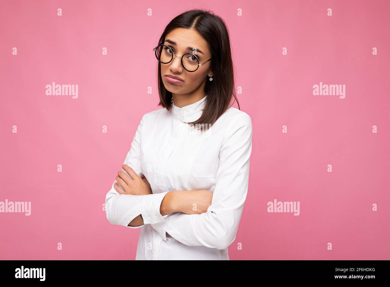 Attractive young sorrowful touchy brunette woman wearing everyday ...