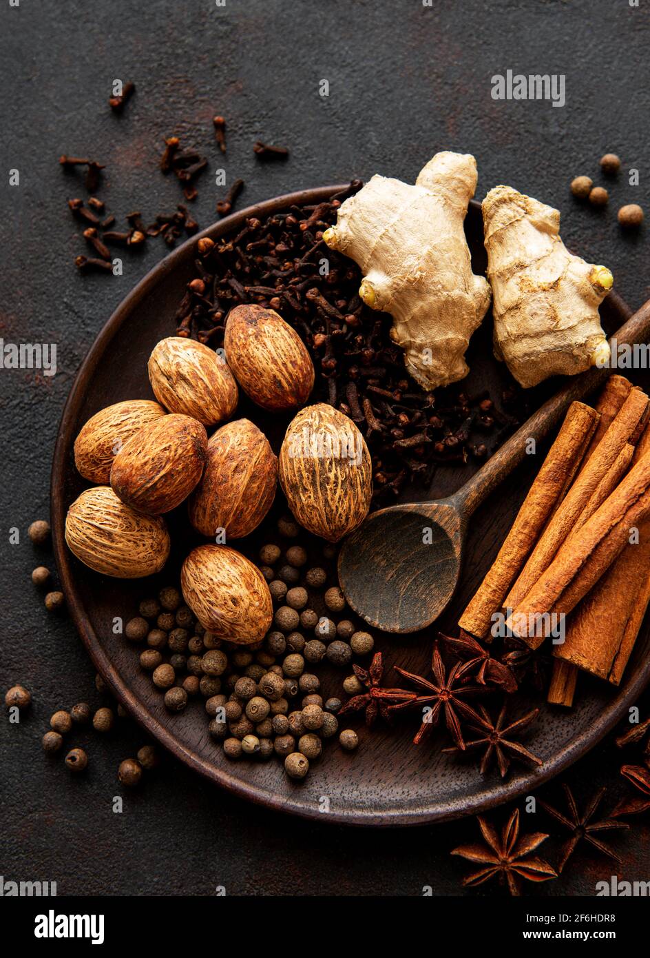 Gingerbread spices on slate - star anise, cinnamon, cloves, nutmeg ...