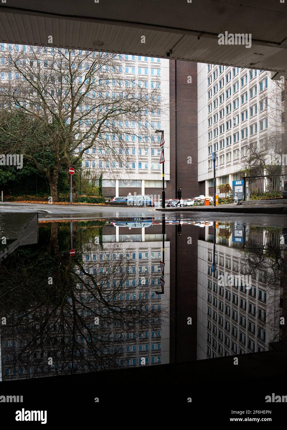 The Axis Building Birmingham England reflected in water gathered below ...