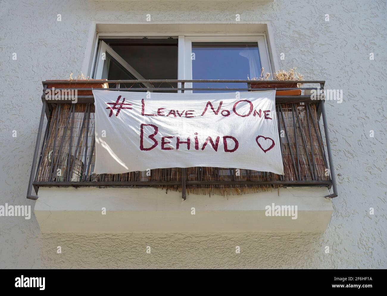 Banner Leave no one behind, Berlin, Germany Stock Photo - Alamy