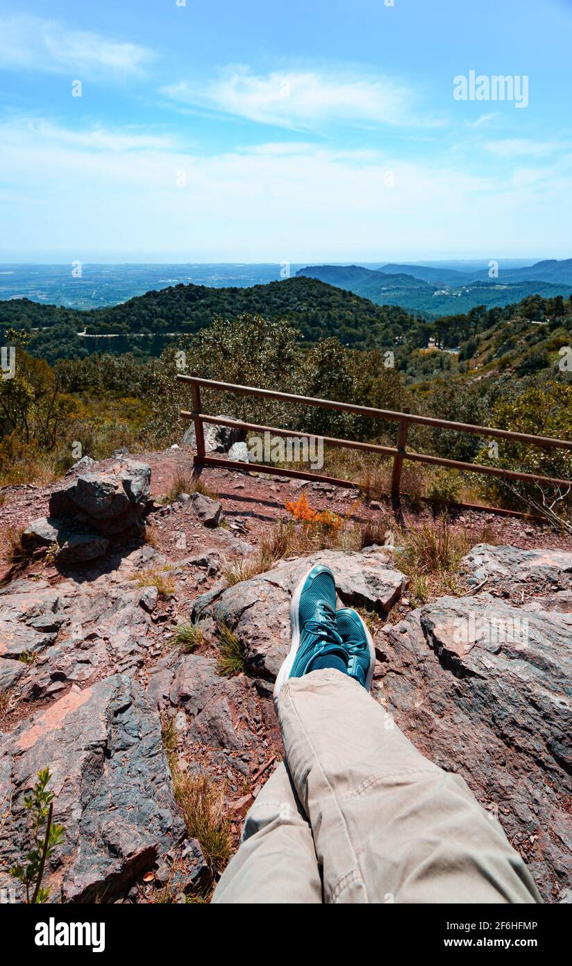 First person perspective shot from a hiker sitting Hiker sitting on top ...