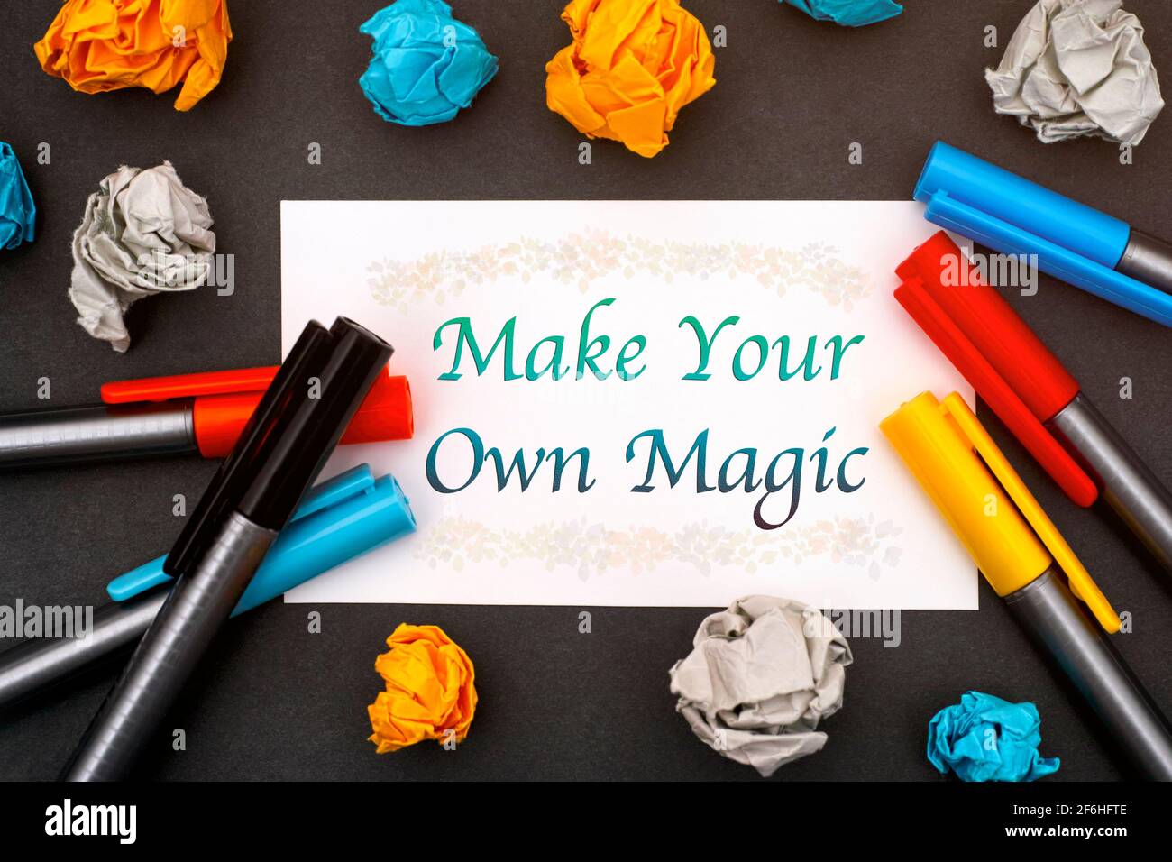 Paper with phrase Make Your Own Magic with colour pens and crumpled ...
