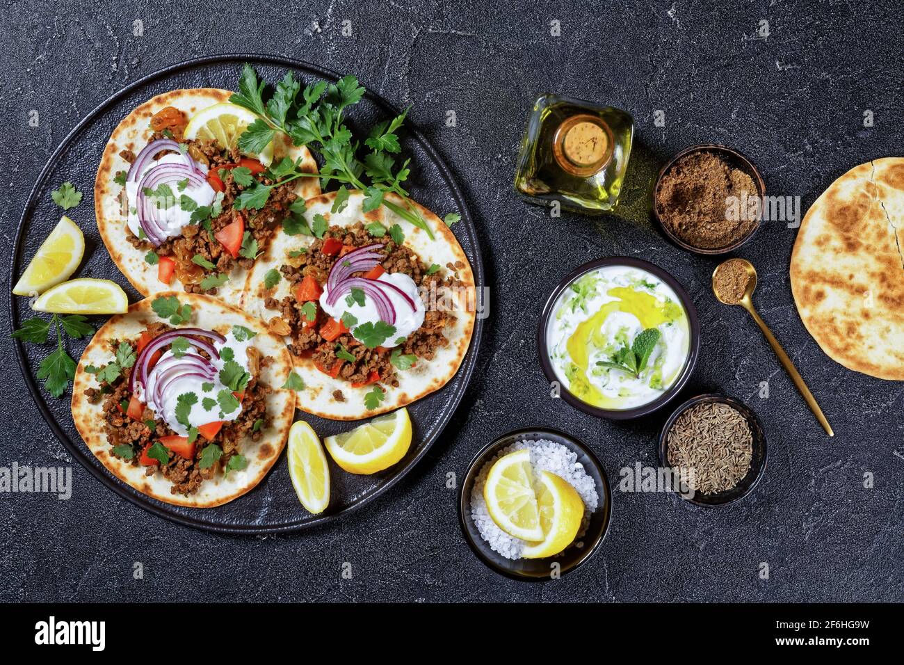 ground Lamb Flatbreads topped with yogurt, coriander leaves and red ...