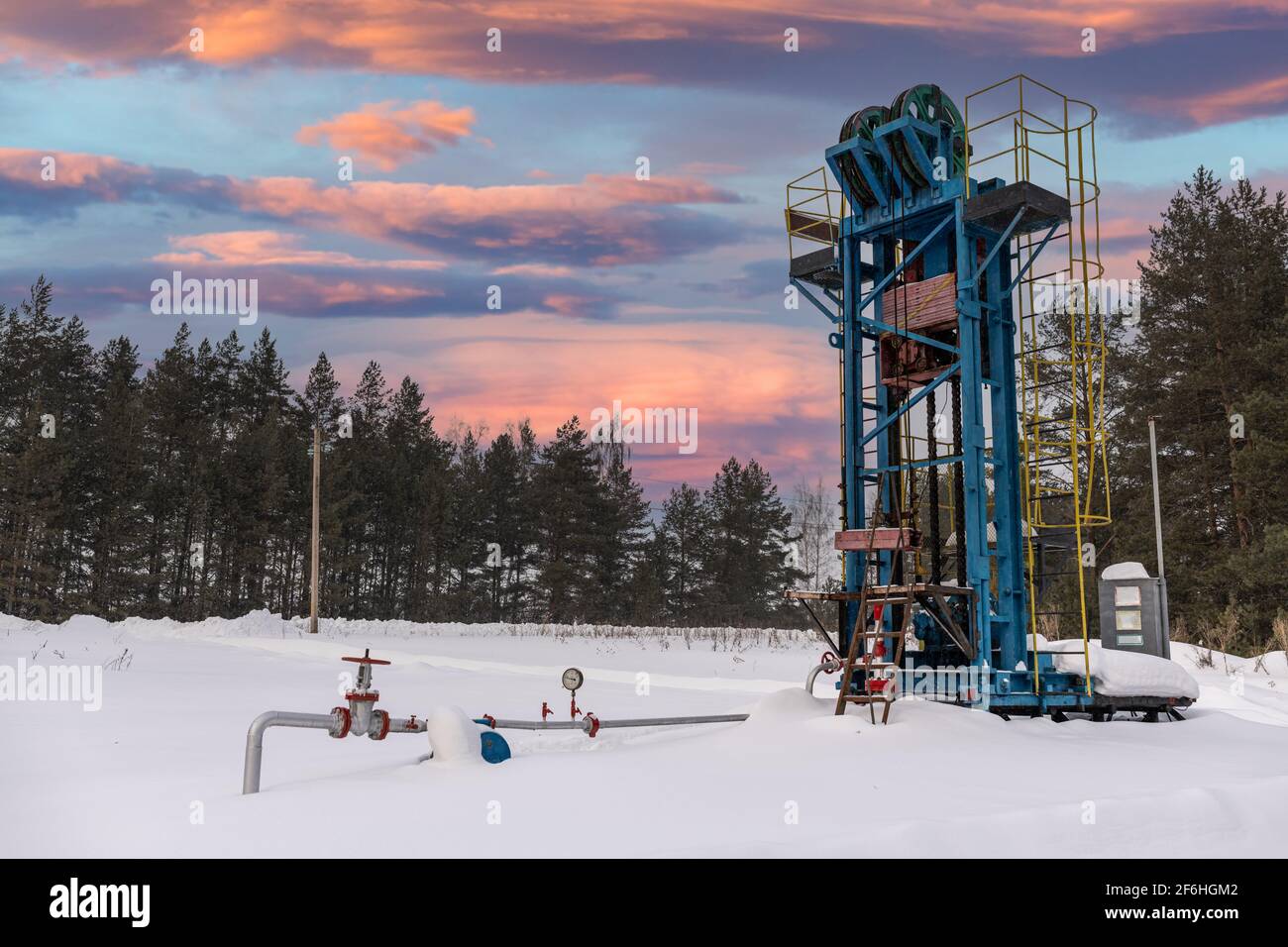 Oil pumpjack winter working. Oil rig energy industrial machine for ...