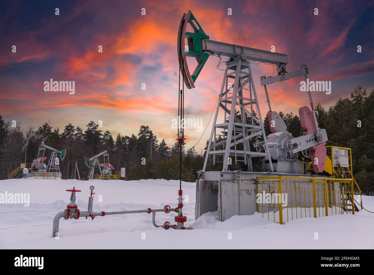 Oil rig energy industrial machine for petroleum in the sunset ...