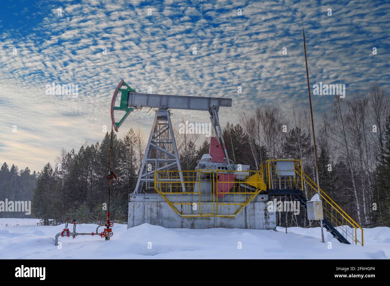 Oil pumpjack winter working. Oil rig energy industrial machine for ...