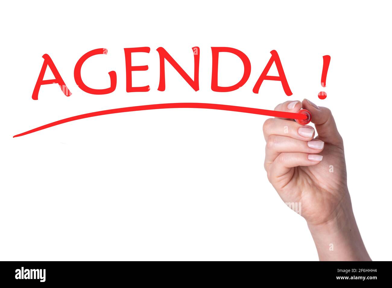Hand writes word agenda with red marker on transparent white background ...