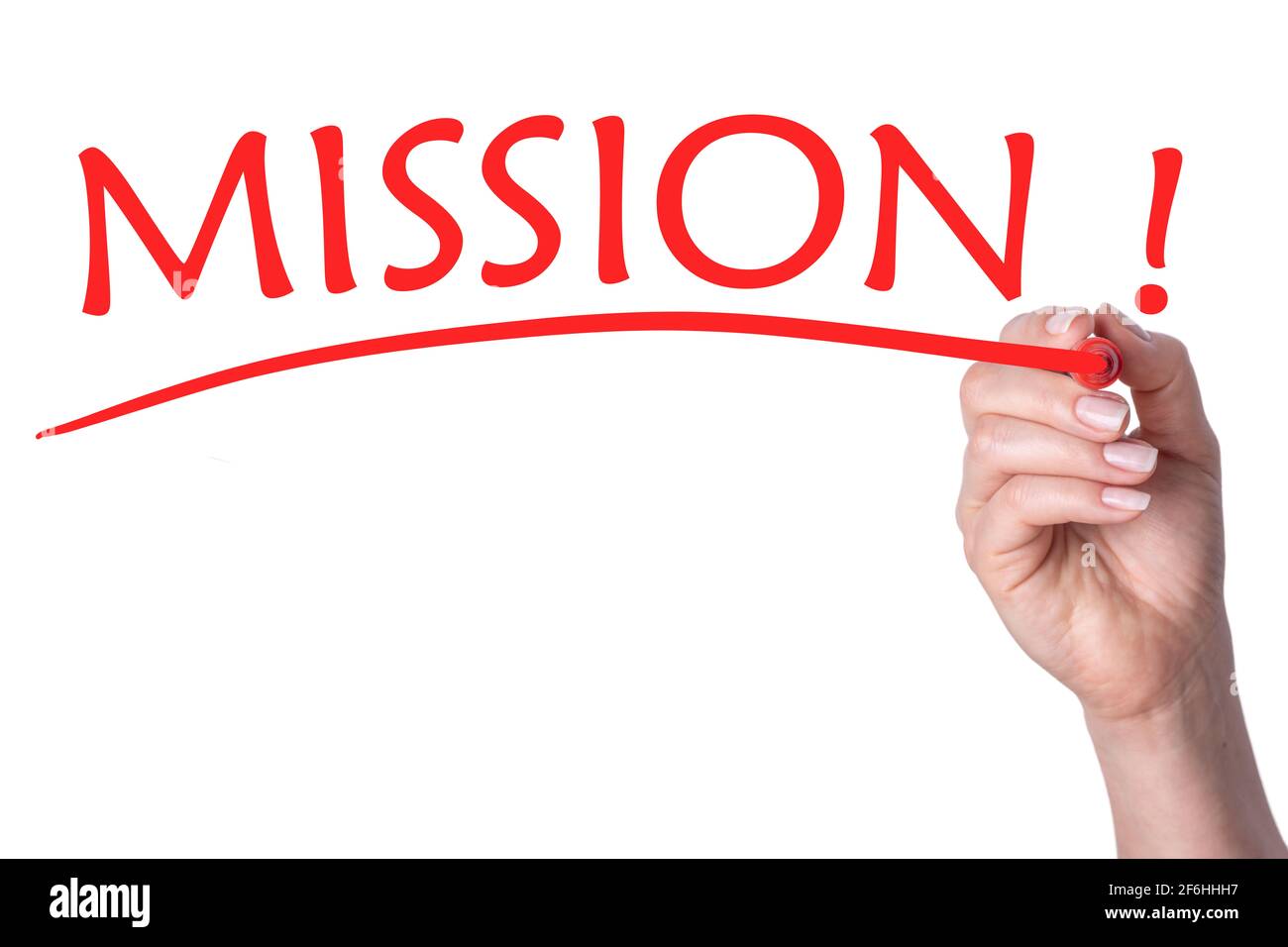 Hand writes word mission with red marker on transparent white ...