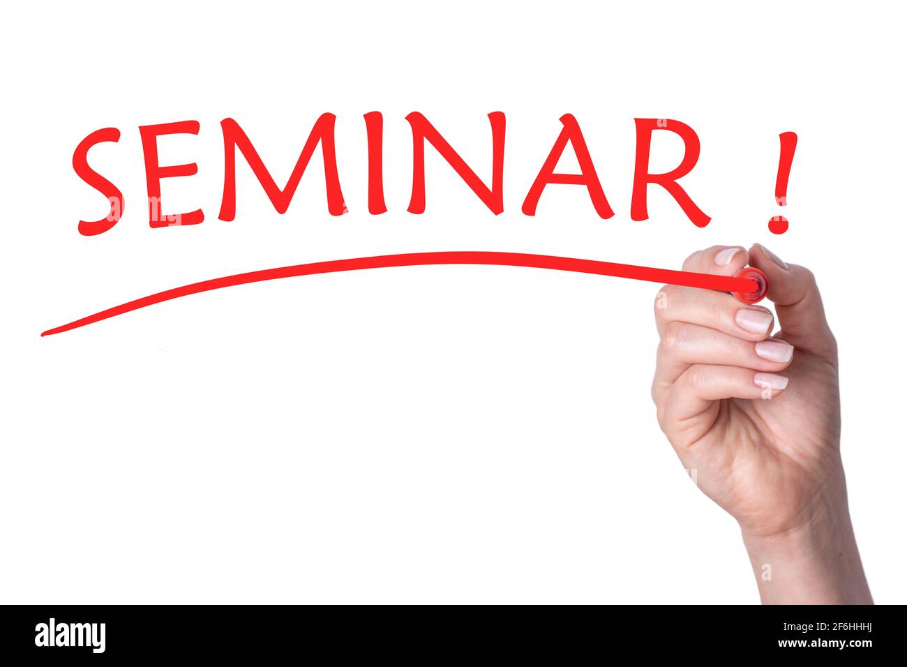 Hand writes word seminar with red marker on transparent white ...