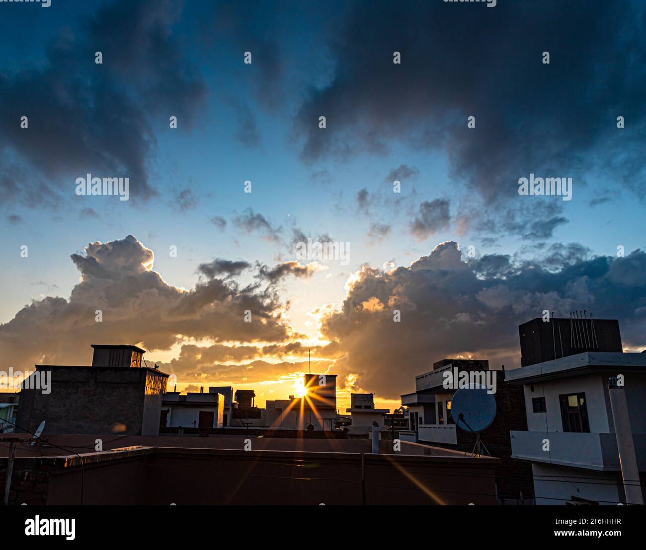 colorful silhouette of the buildings over colorful sky background with ...