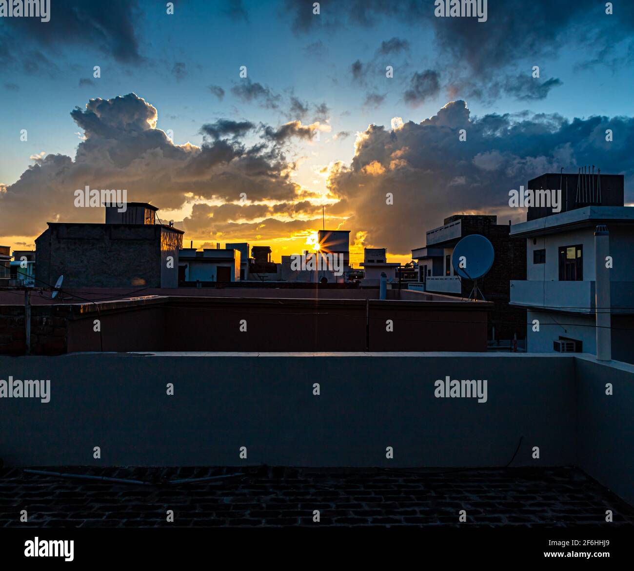 colorful silhouette of the buildings over colorful sky background with ...