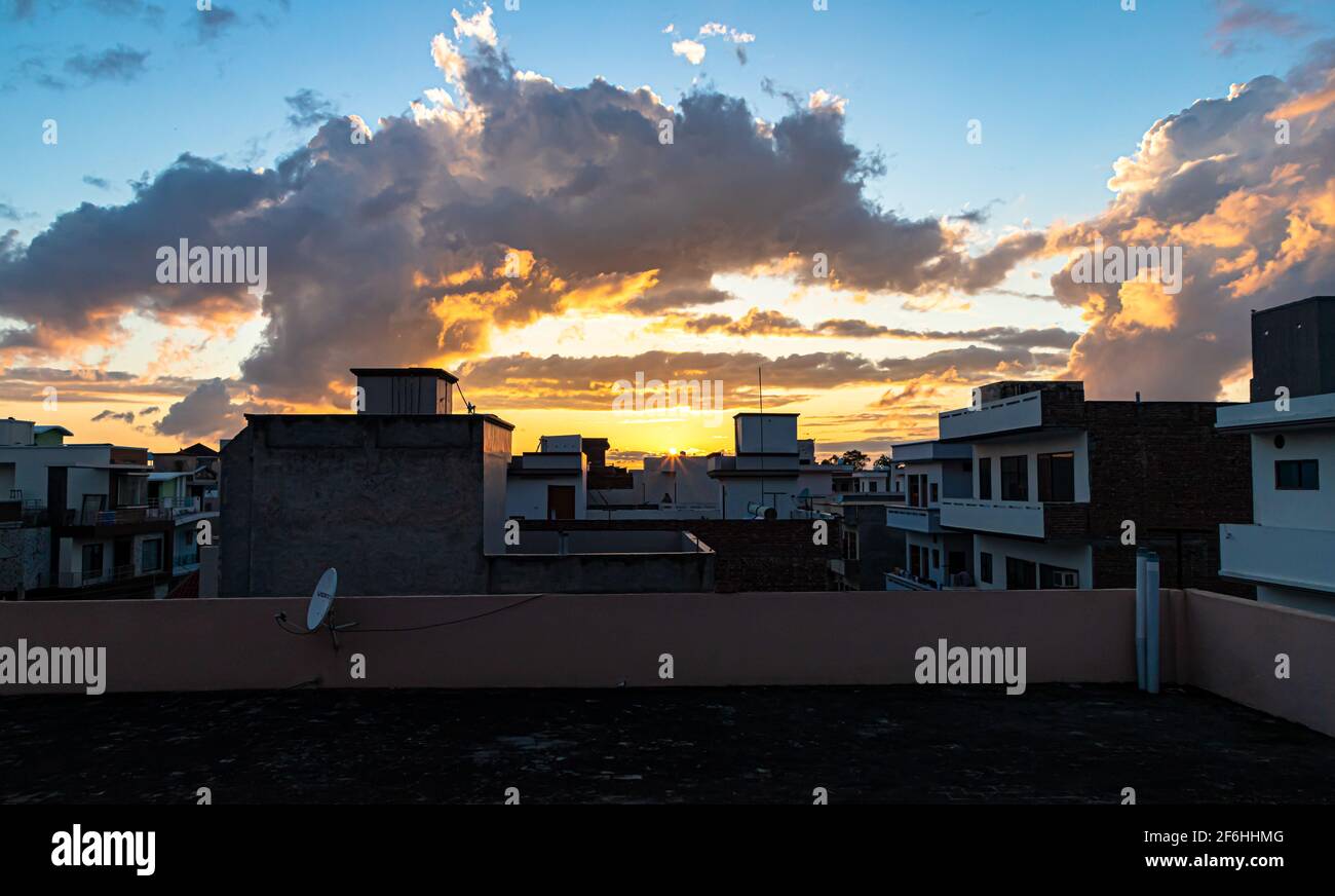 colorful silhouette of the buildings over colorful sky background with ...