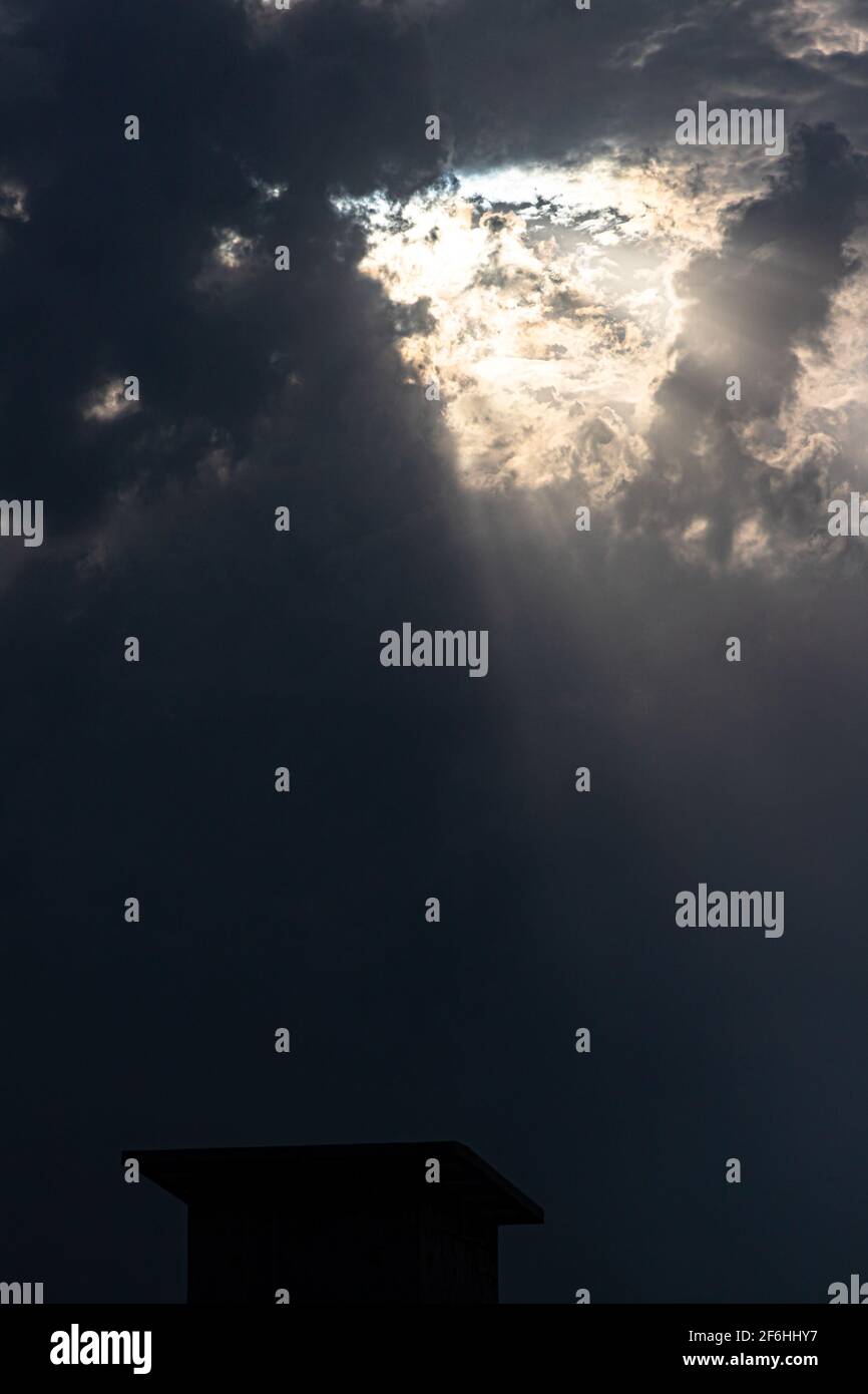 Sun shining through storm cloud hi-res stock photography and images - Alamy