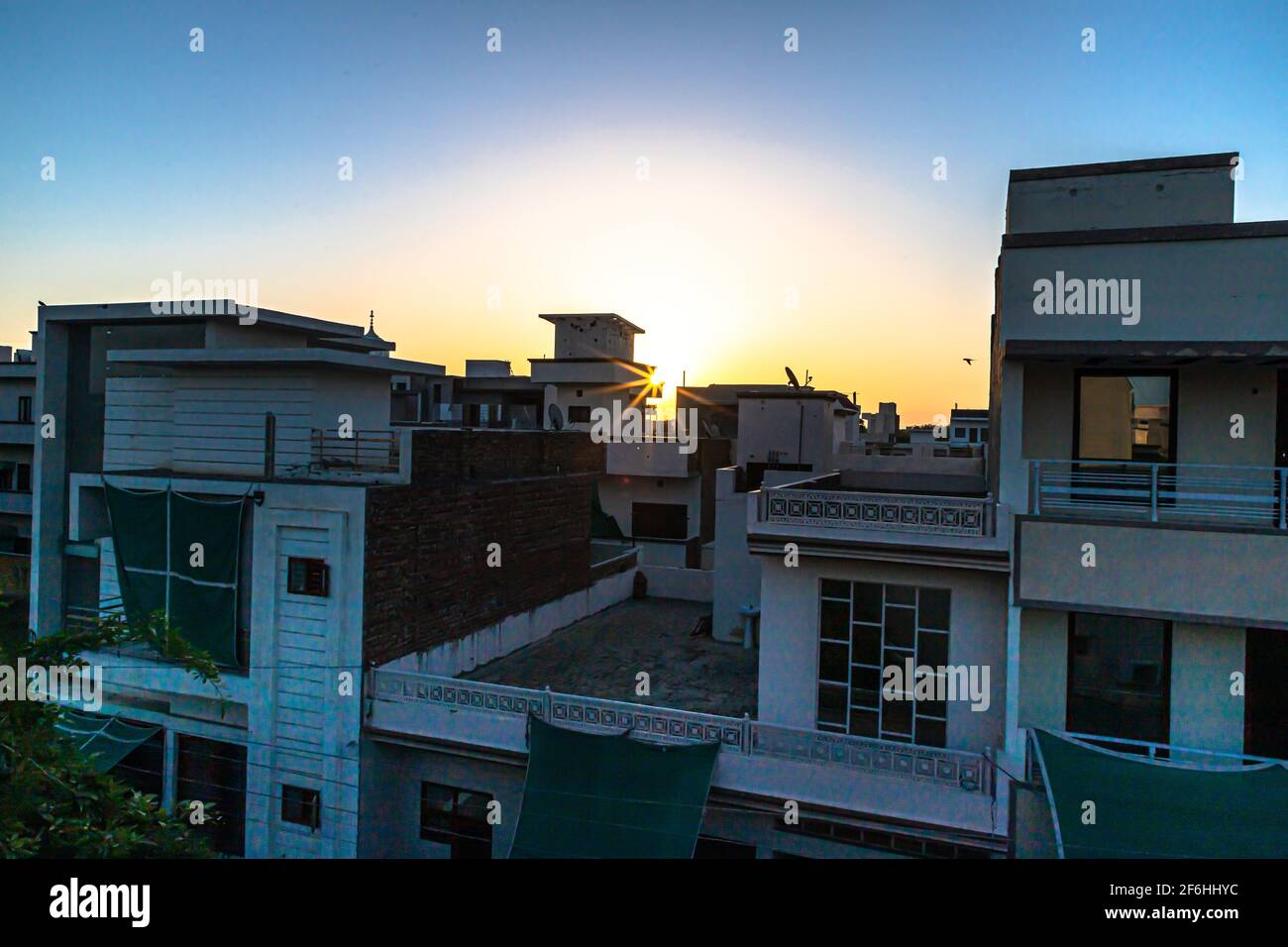 colorful silhouette of the buildings over colorful sky background with ...