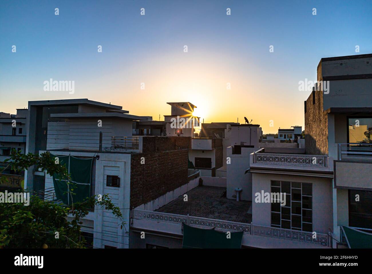 colorful silhouette of the buildings over colorful sky background with ...