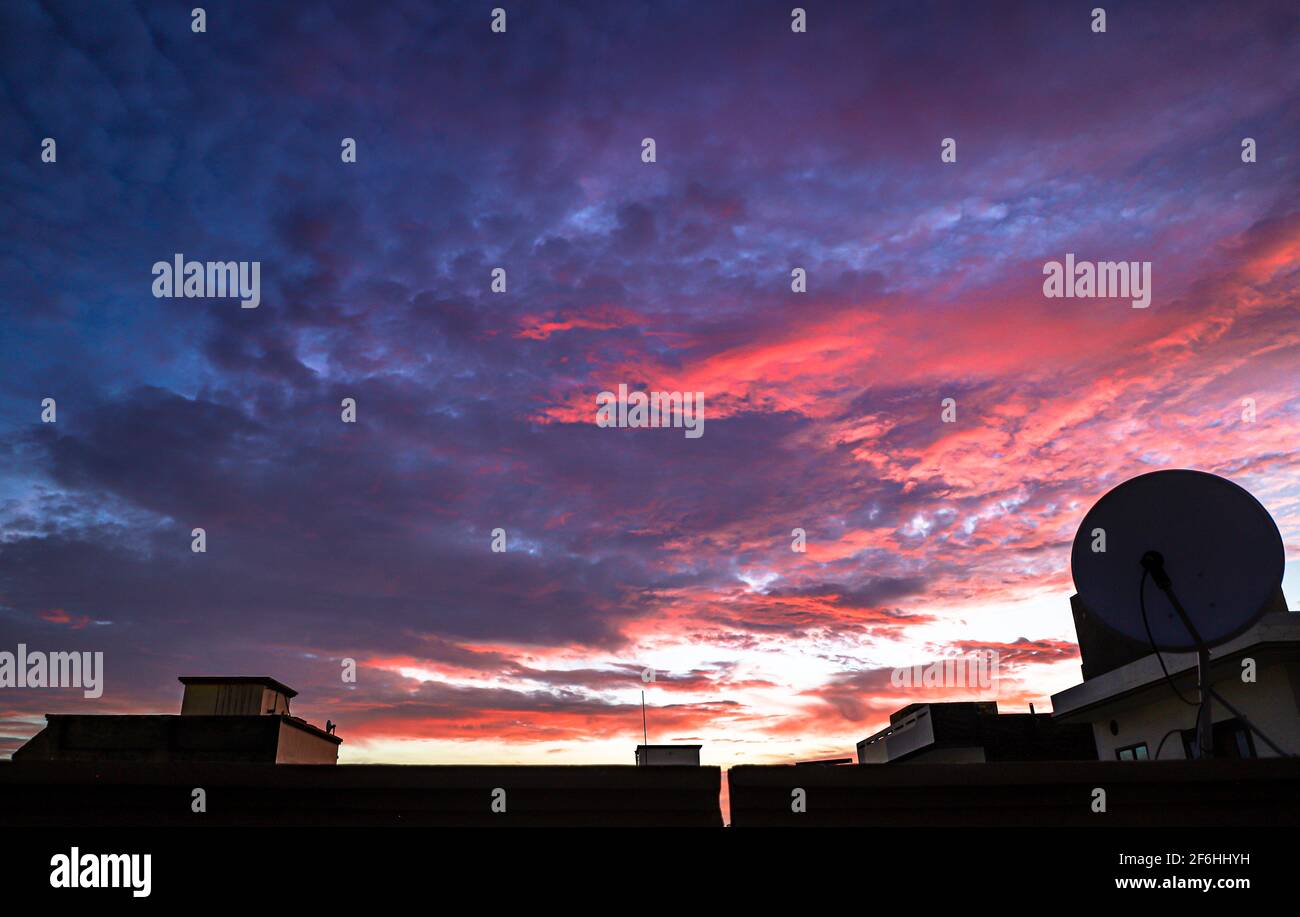 colorful silhouette of the buildings over colorful sky background with ...