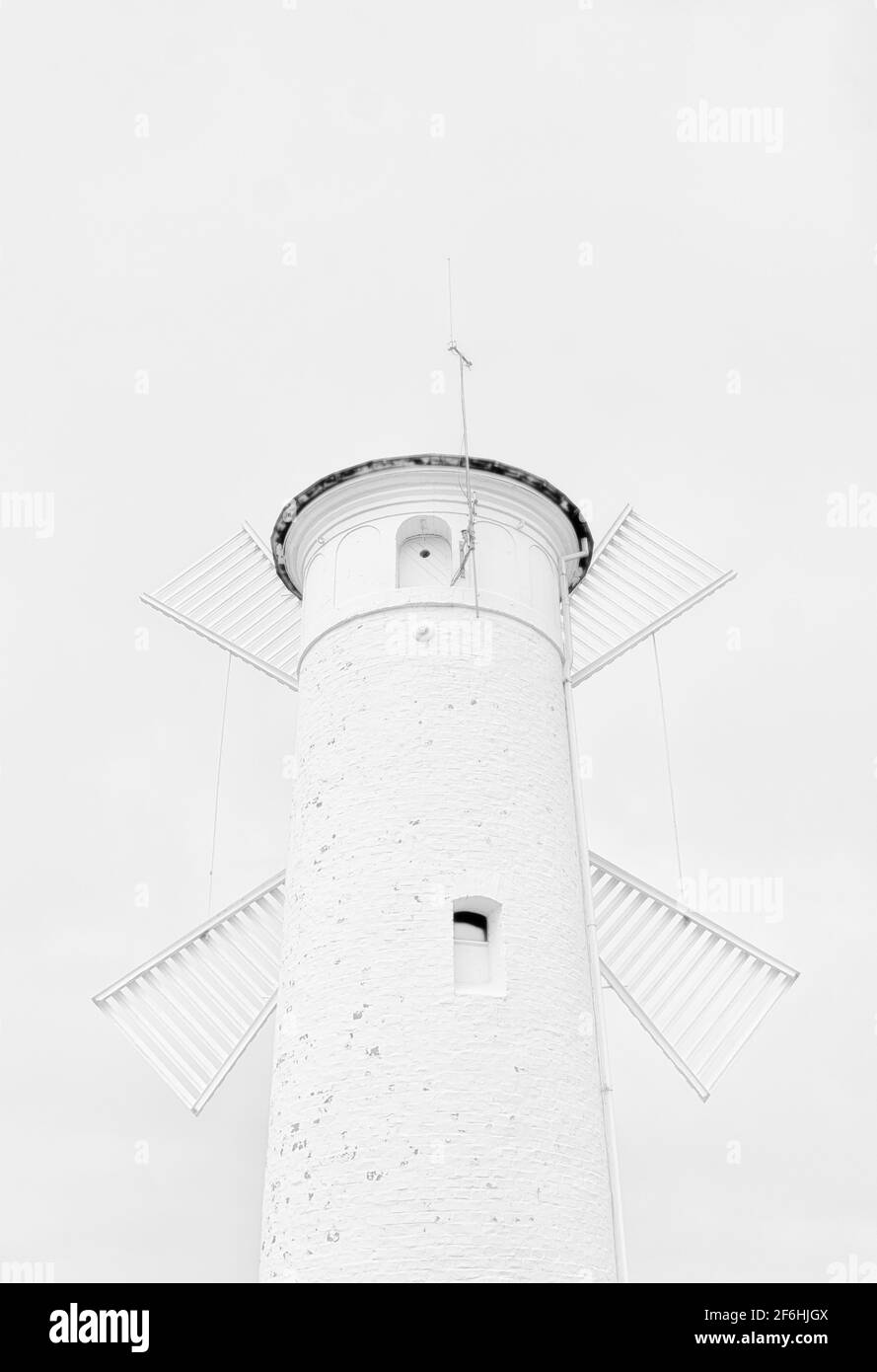 White windmill and lighthouse on a white background Stock Photo - Alamy