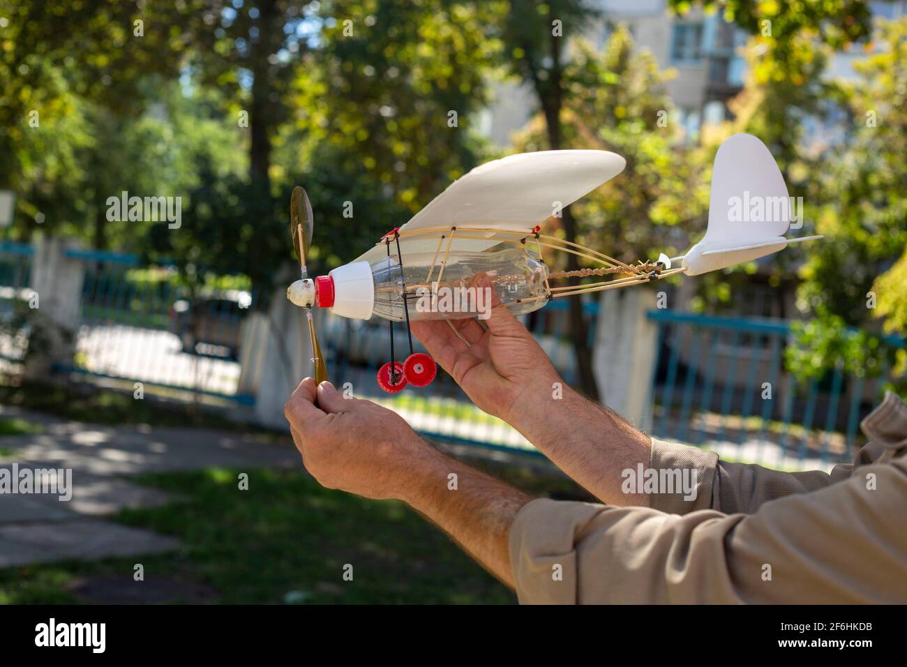 Airplane model with a propeller made from household waste plastic on a ...