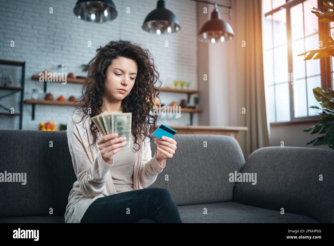 Female cash hi-res stock photography and images - Alamy