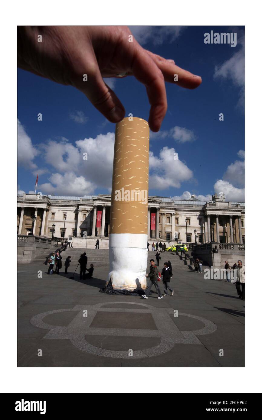 A giant cigarette butt is installed in Trafalgar Square on April 8 ...