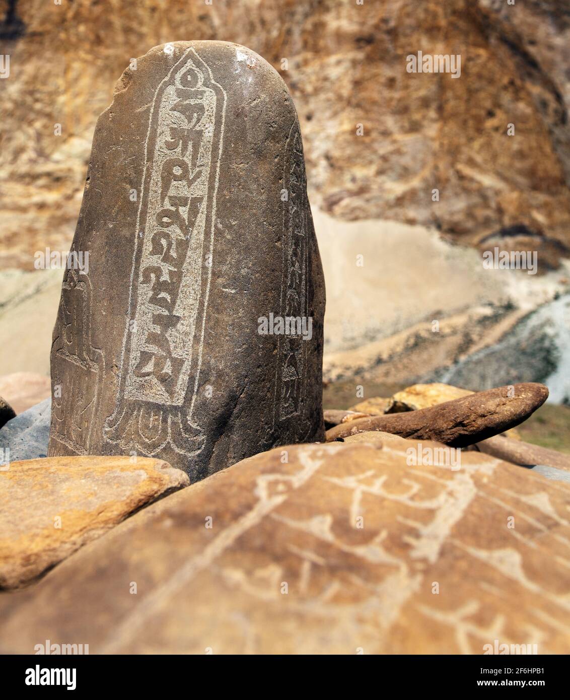 Mani wall and stone with buddhist symbols Stock Photo - Alamy