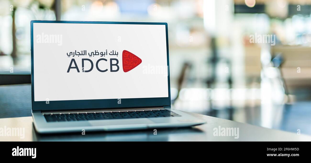 POZNAN, POL - MAR 15, 2021: Laptop computer displaying logo of ADCB, a ...