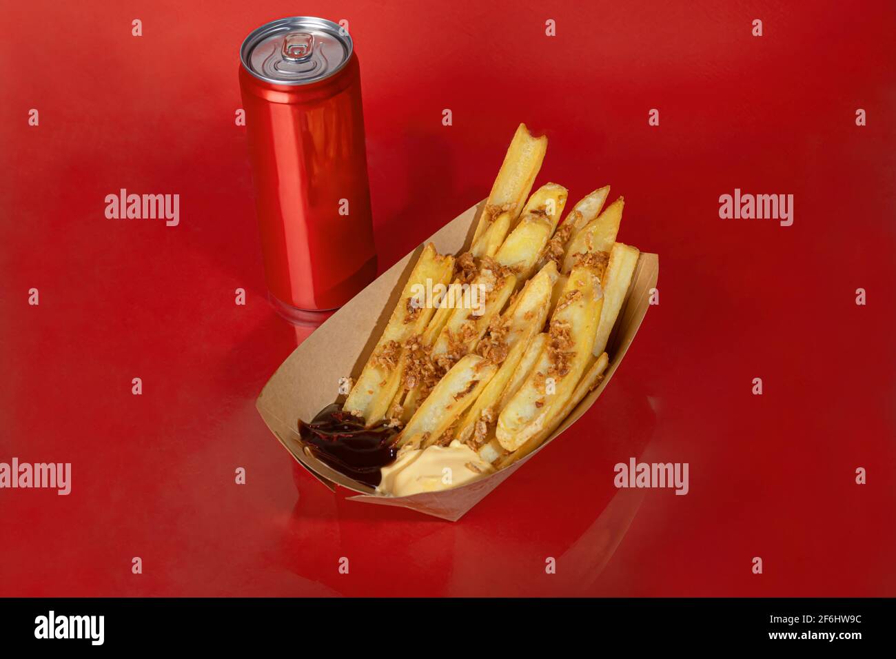 French fries with two sauces in a paper plate. Takeout food. Colored ...