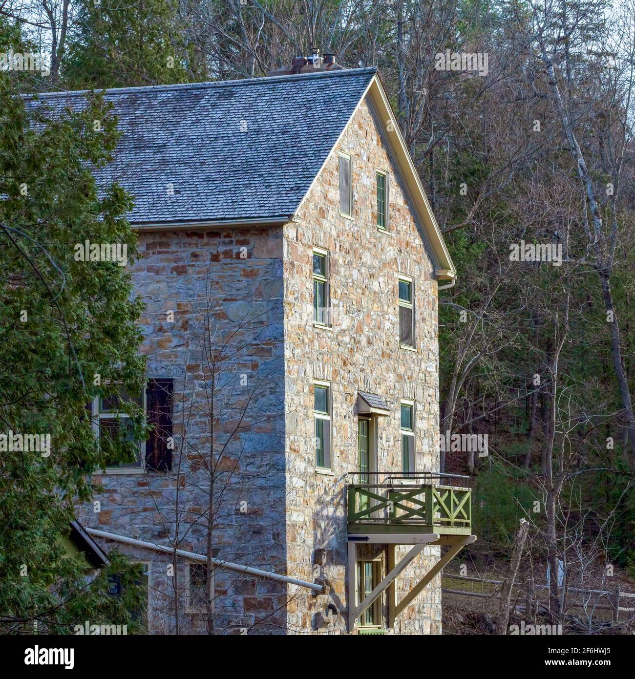 A Window to the Past - A grist mill surrounded by trees, now a museum ...