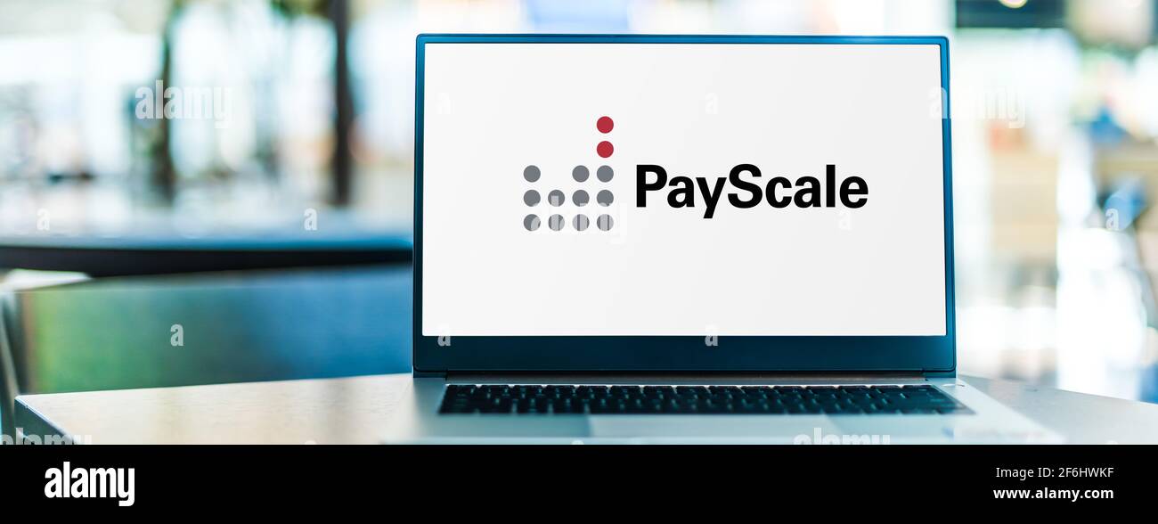 POZNAN, POL - FEB 6, 2021: Laptop displaying logo of PayScale an ...