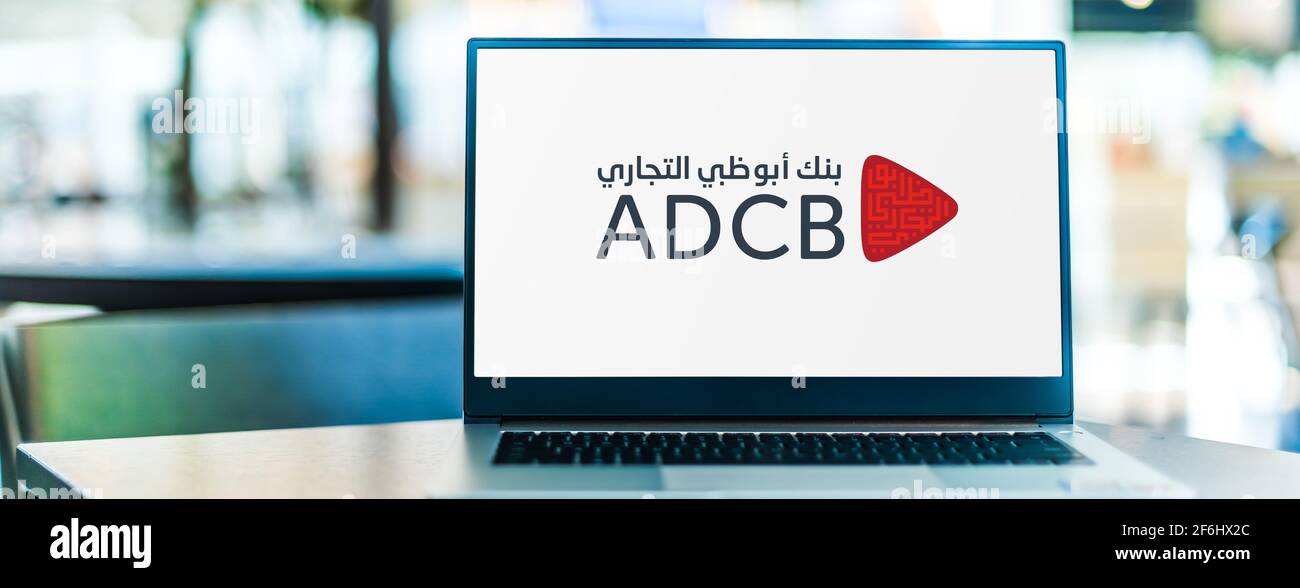 POZNAN, POL - MAR 15, 2021: Laptop computer displaying logo of ADCB, a ...
