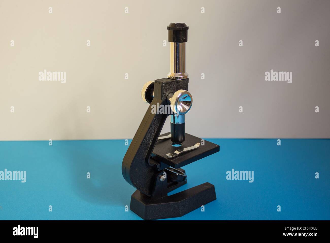 Single microscope suited for any medical concepts on a blue and white ...