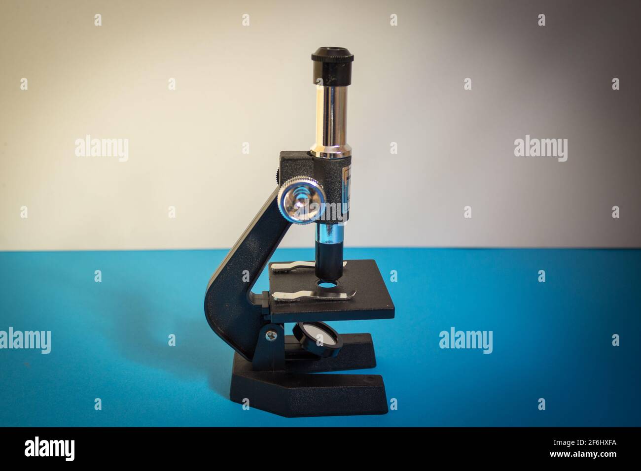 Single microscope suited for any medical concepts on a blue and white ...