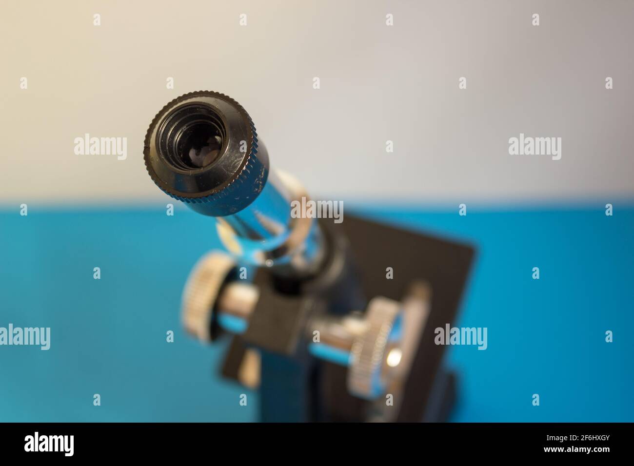 Single microscope suited for any medical concepts on a blue and white ...