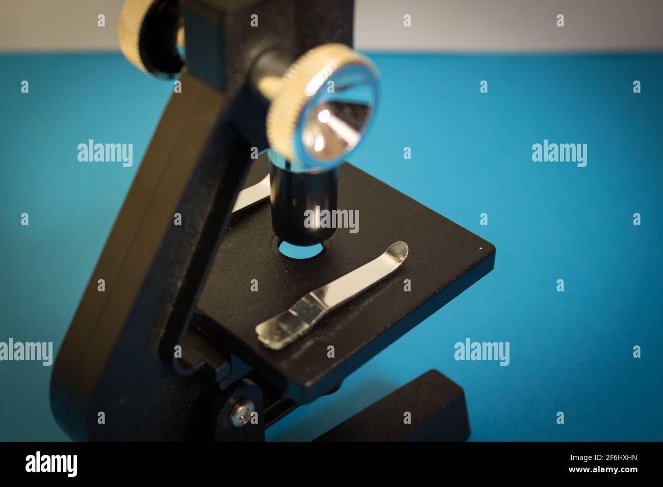 Single microscope suited for any medical concepts on a blue and white ...