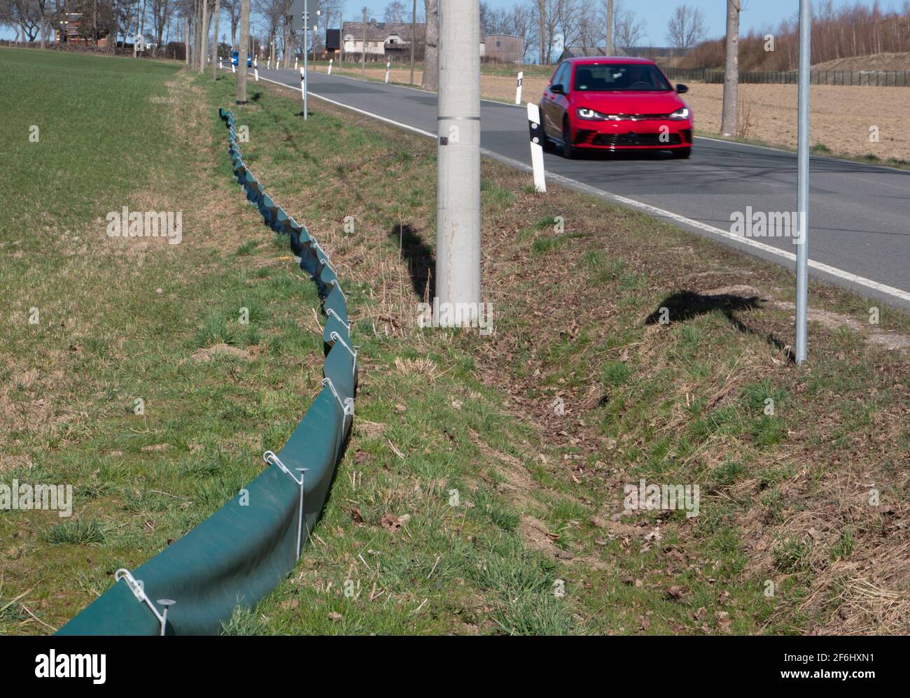 Toad fence protection on the road Stock Photo - Alamy