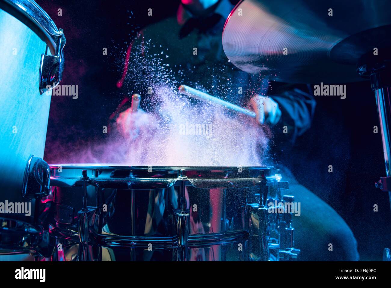 Drummer's rehearsing on drums before rock concert. Man recording music ...