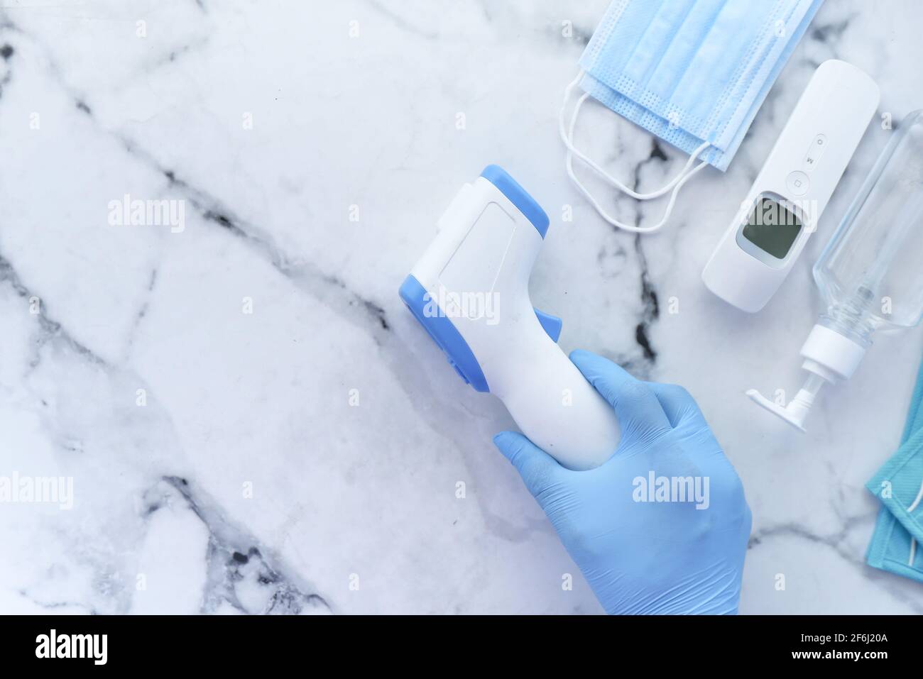 Hand holding infrared thermometer to measuring temperature Stock Photo ...