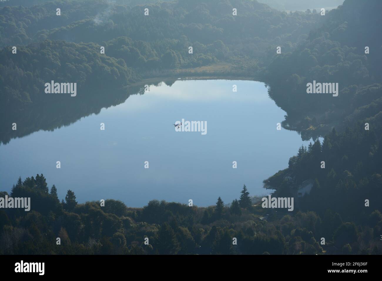 Flying drone camera filming lake hi-res stock photography and images ...