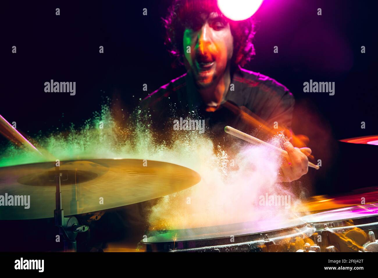 Drummer's rehearsing on drums before rock concert. Man recording music ...