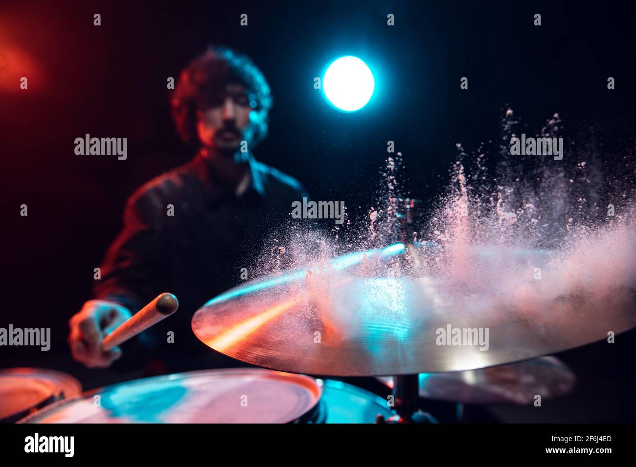 Drummer's rehearsing on drums before rock concert. Man recording music ...