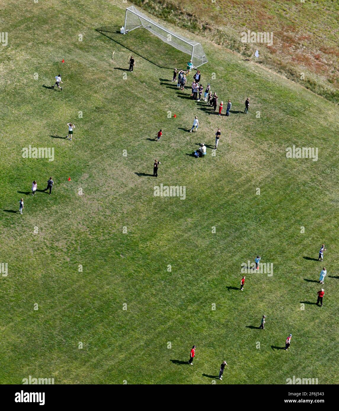 Aerial view of a soccer field where a school class is playing rounders ...