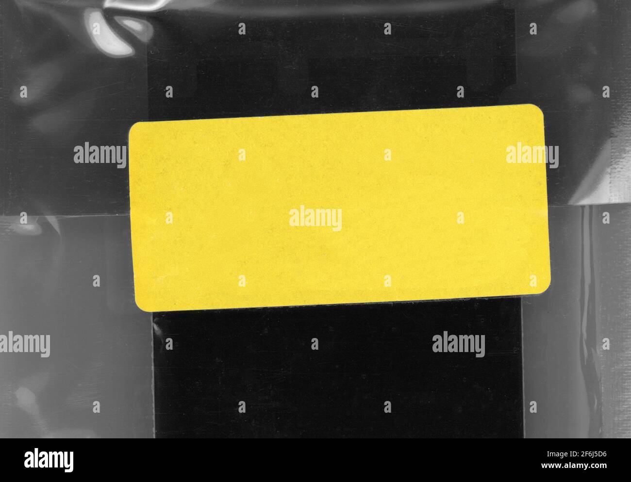 sachet with yellow paper tag label for product information Stock Photo ...