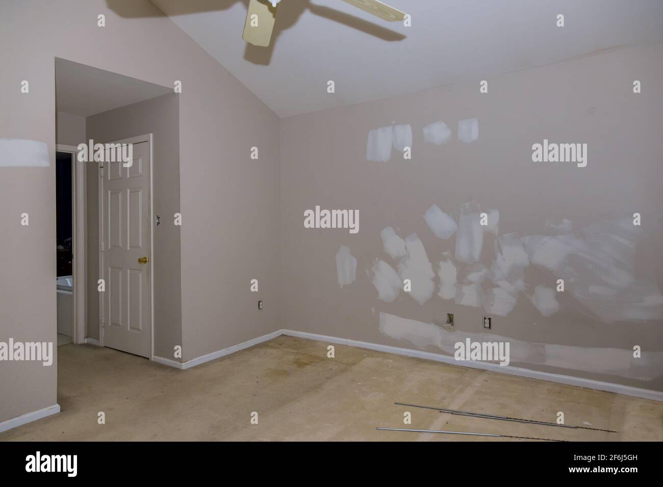 Wall with damage spreading to plaster a damaged wall, repairing works ...