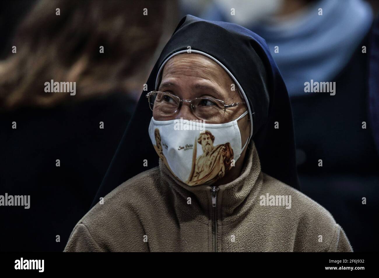 April 1, 2021 - Vatican City (Holy See) A nun with mask with image of ...