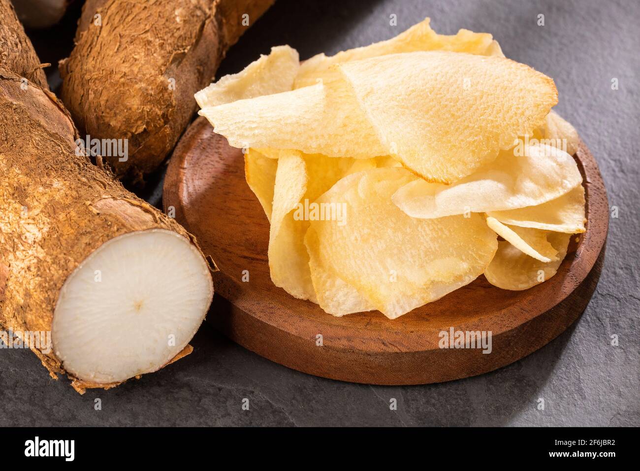 Manihot esculenta - Fried cassava slices. Text space Stock Photo - Alamy